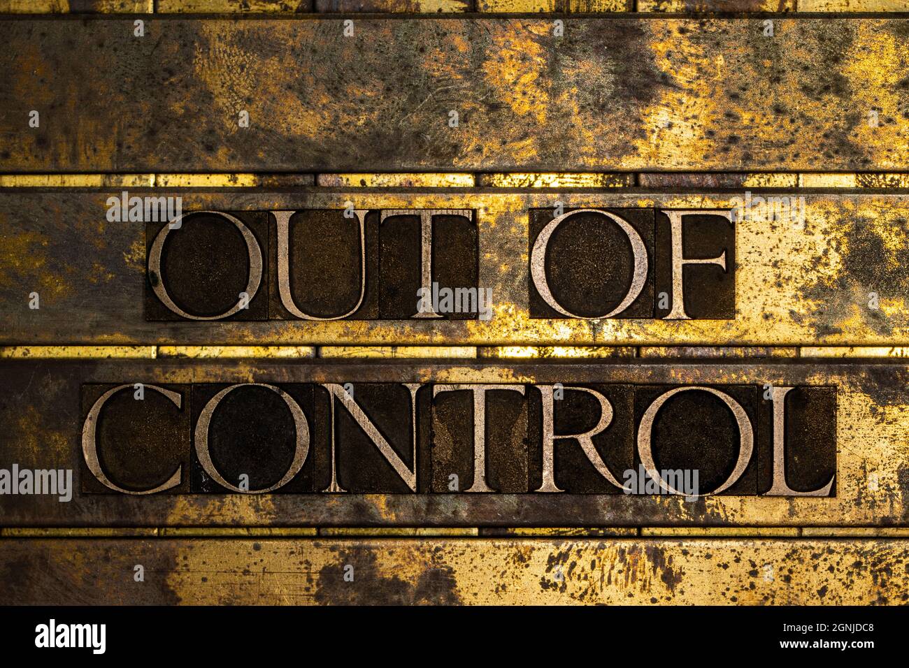 Out of Control text on textured grunge copper and vintage gold ...