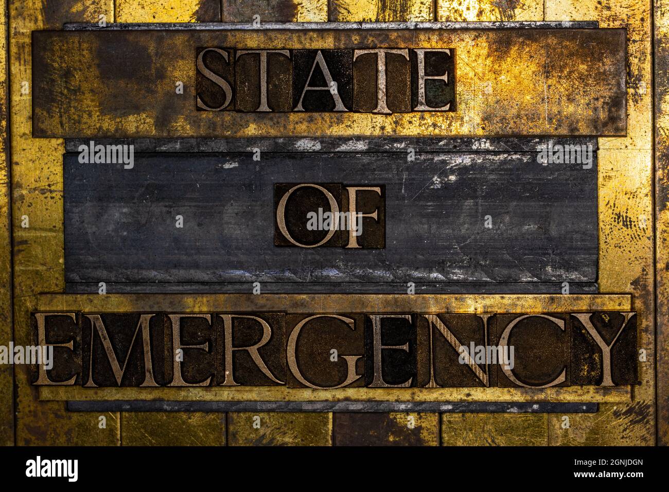 State of Emergency text on textured grunge copper and vintage gold ...