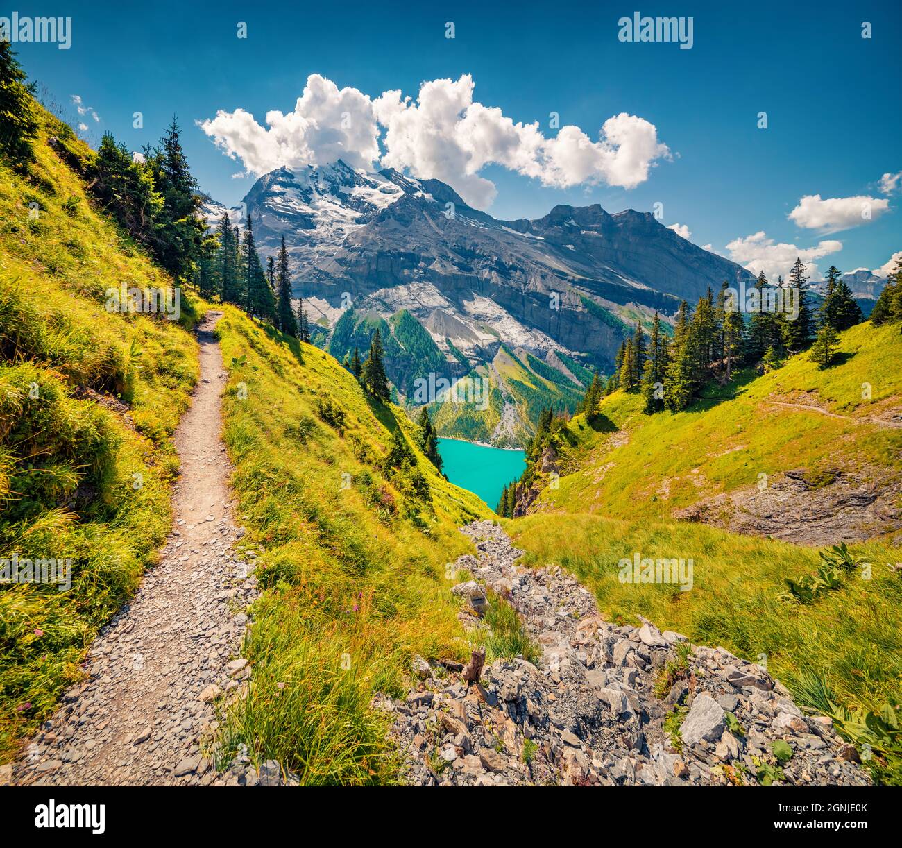 Empty tourist trek on the hill of Oeschinensee Lake. Bright summer ...