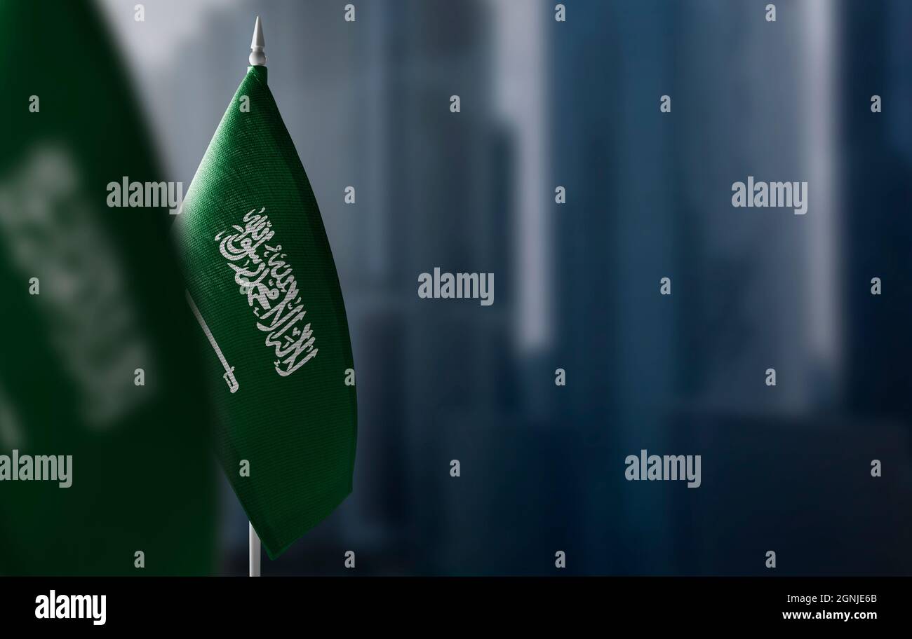 Small flags of Saudi Arabia on a blurry background of the city Stock ...