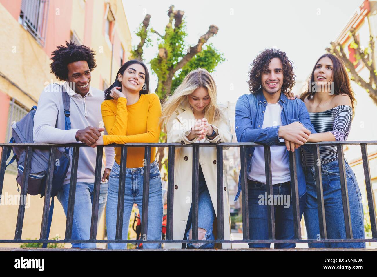 Multiracial group of young people talking together in the street Stock ...