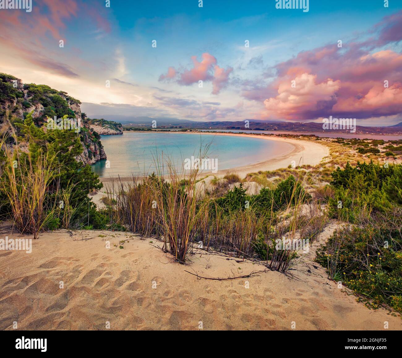 Fantastic summer sunset on Voidokilia beach. Colorful evening seascape ...