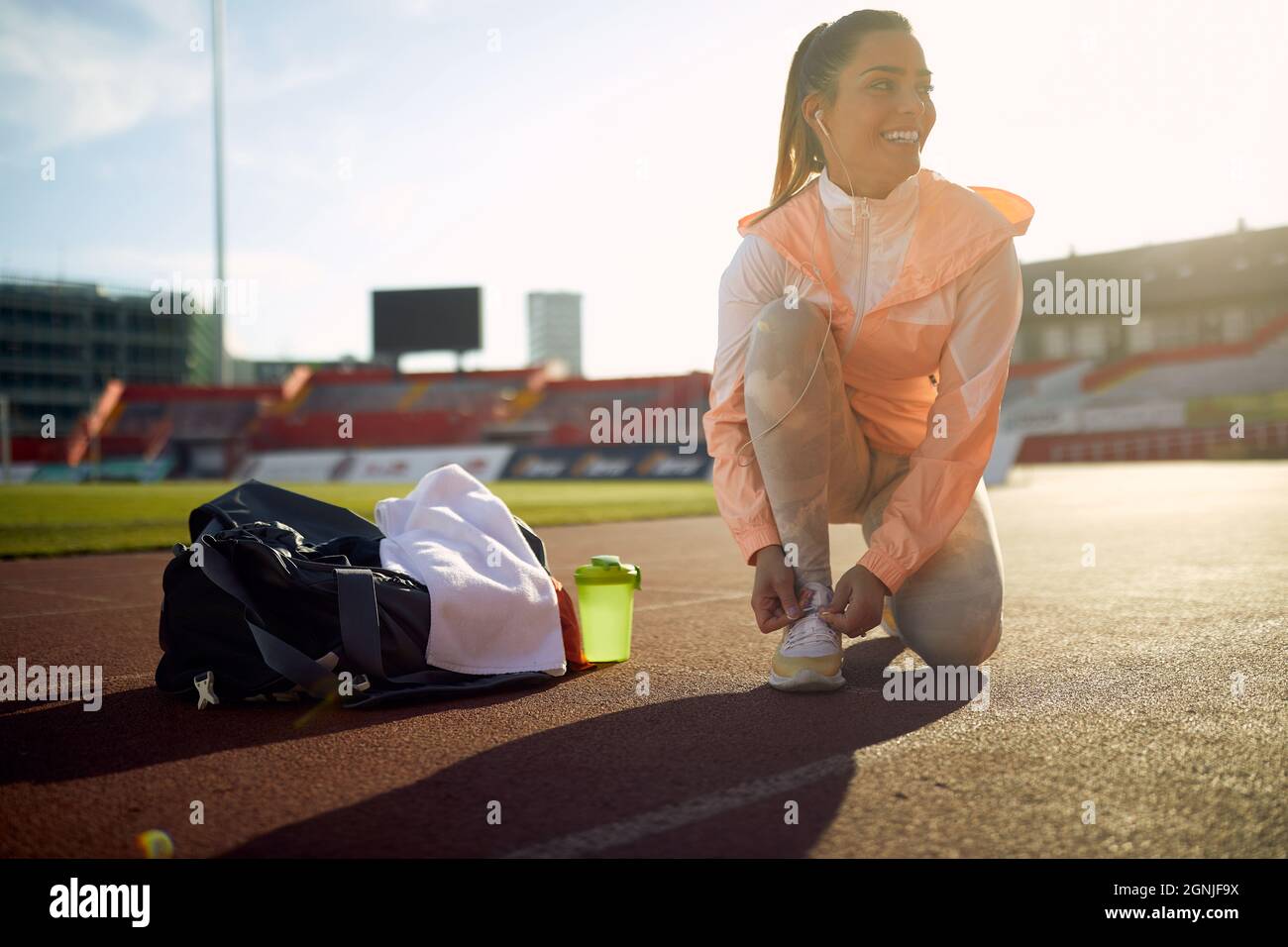 A young girl is ready for an athletic training on a beautiful day at ...