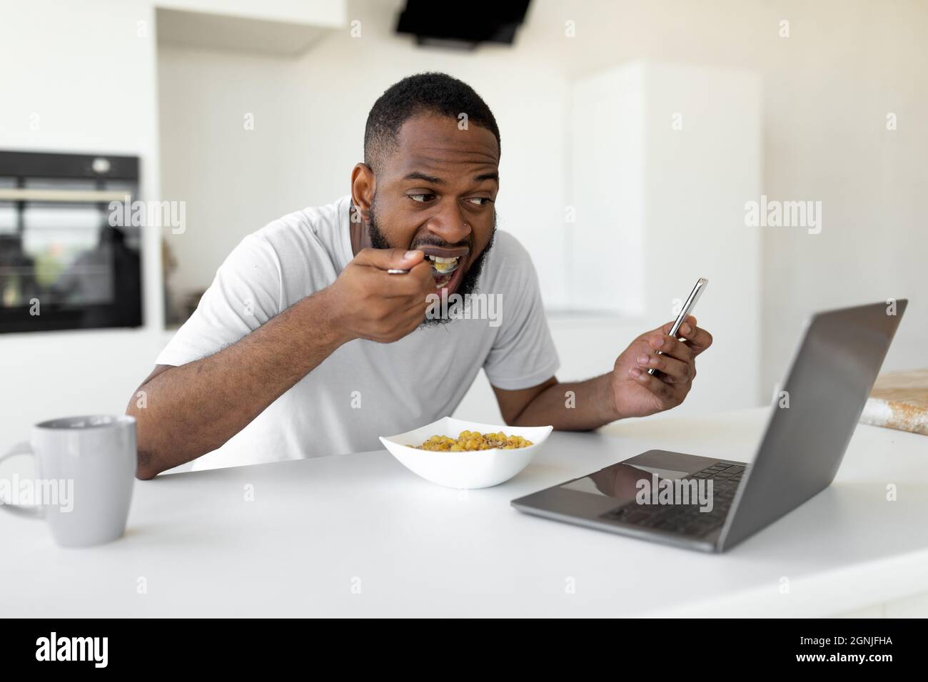 Man eating cereal snack hi-res stock photography and images - Alamy