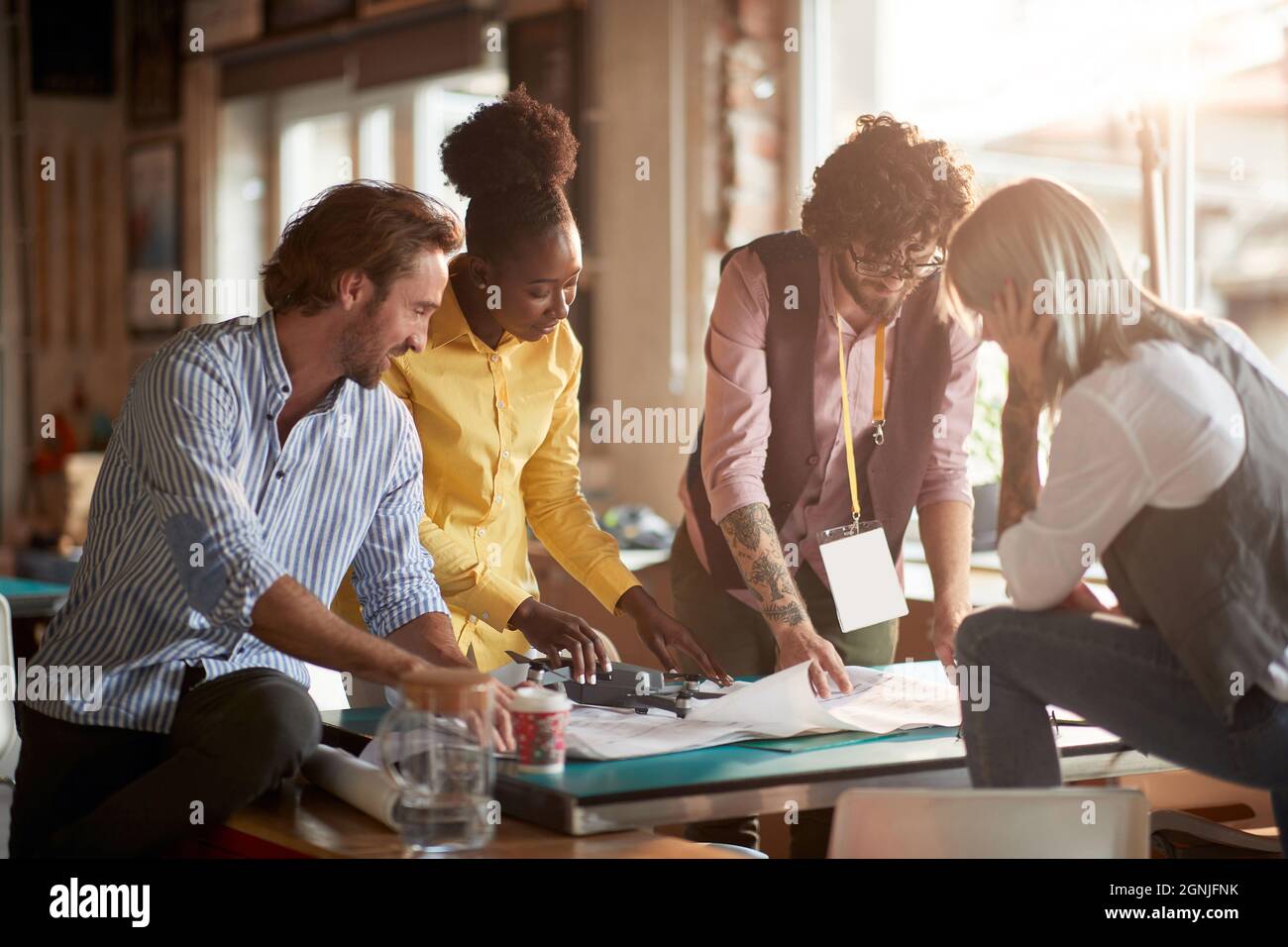 Young colleagues working together planning hi-res stock photography and ...