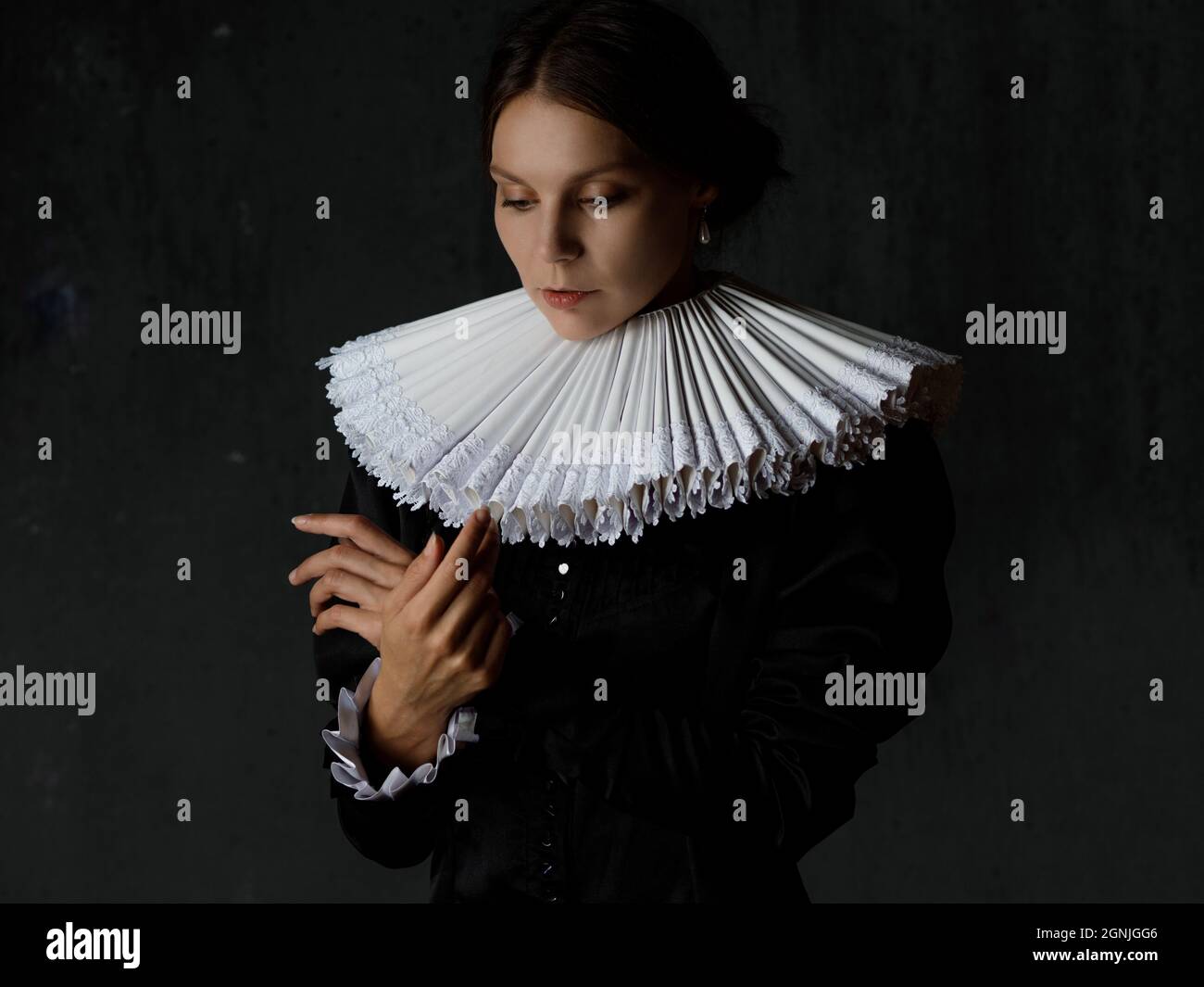 A noble lady in a medieval costume, a young woman in a round Spanish ...