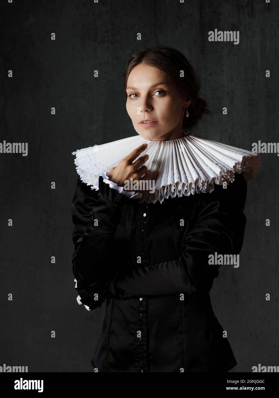 A noble lady in a medieval costume, a young woman in a round Spanish ...