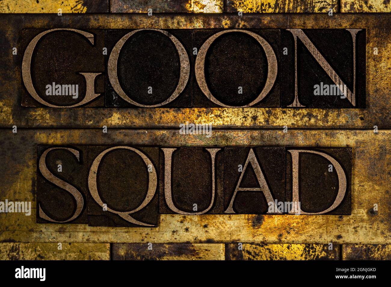 Goon Squad text on textured grunge copper and vintage gold background ...