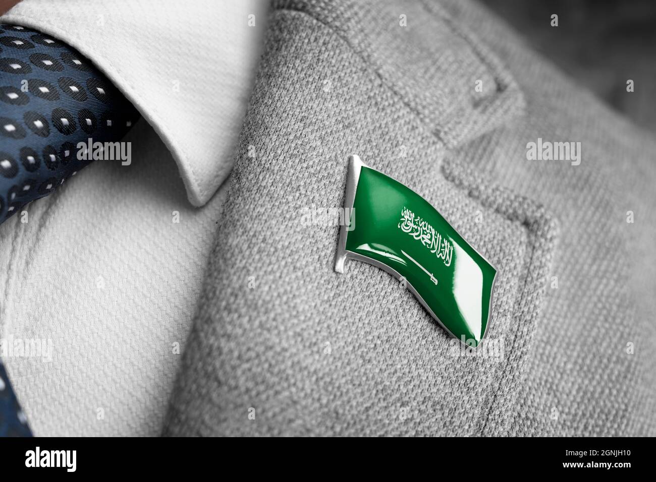 Metal badge with the flag of Saudi Arabia on a suit lapel Stock Photo ...