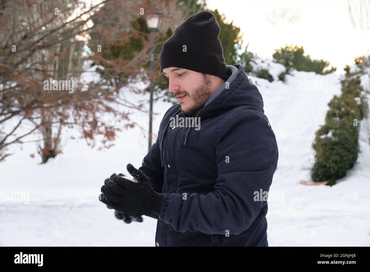 Man making snowball hi-res stock photography and images - Alamy