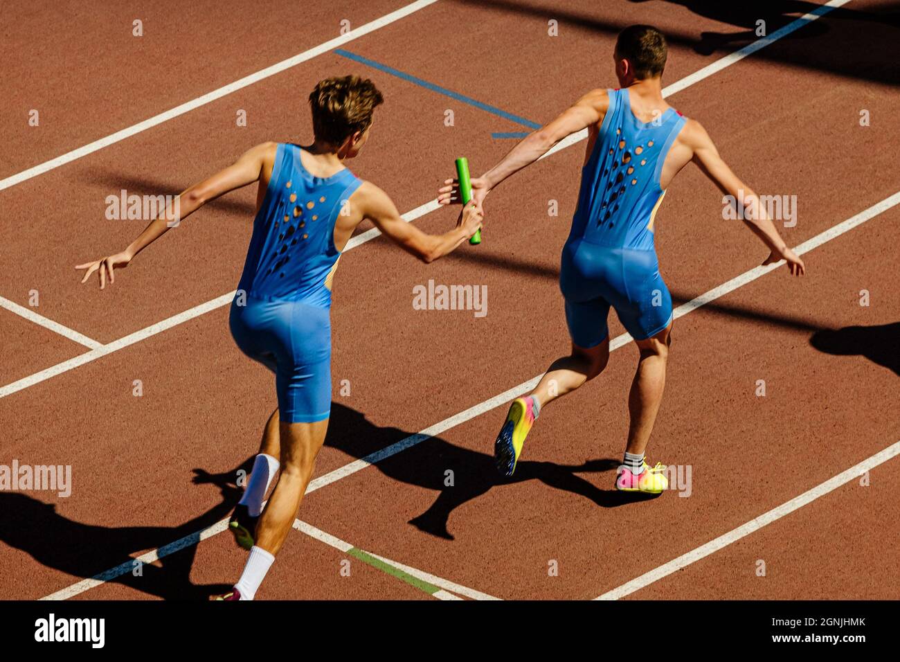 male relay race running for track and field competition Stock Photo - Alamy