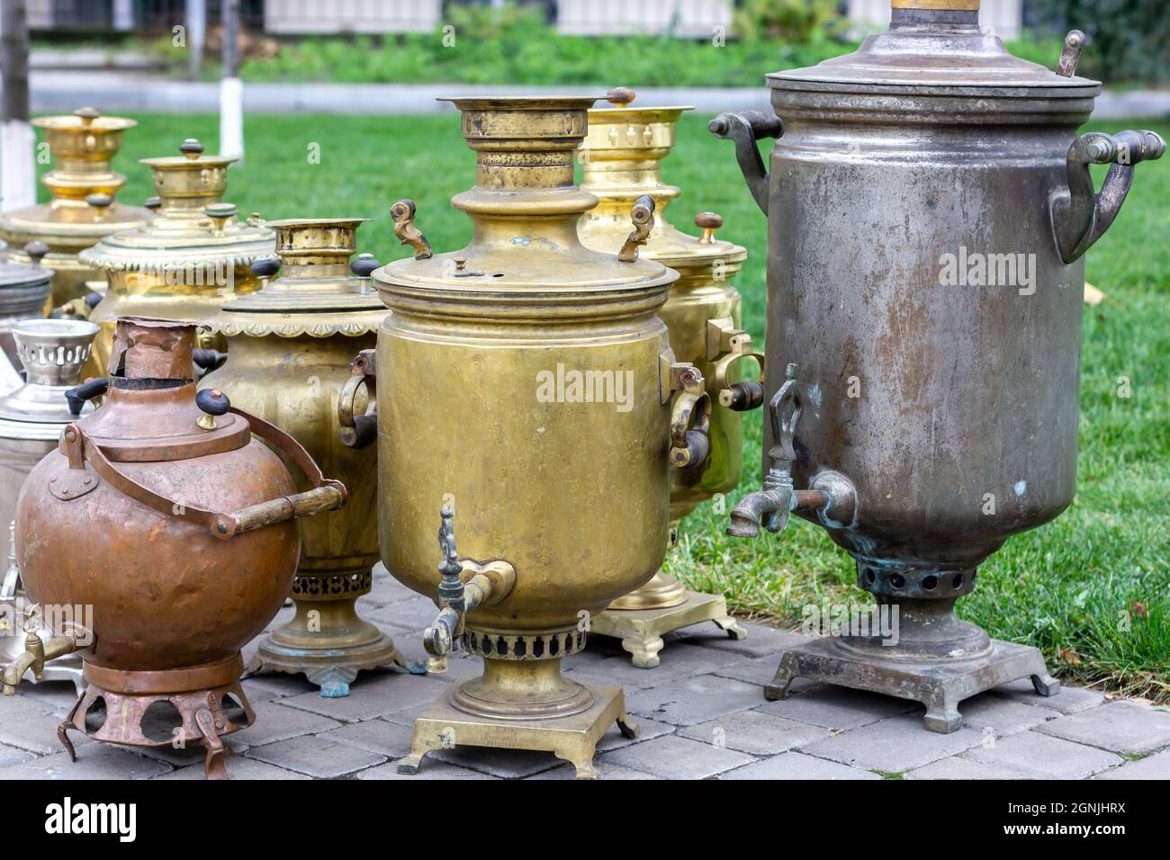 Exhibition of old-fashioned iron samovars. Bronze samovar Stock Photo ...