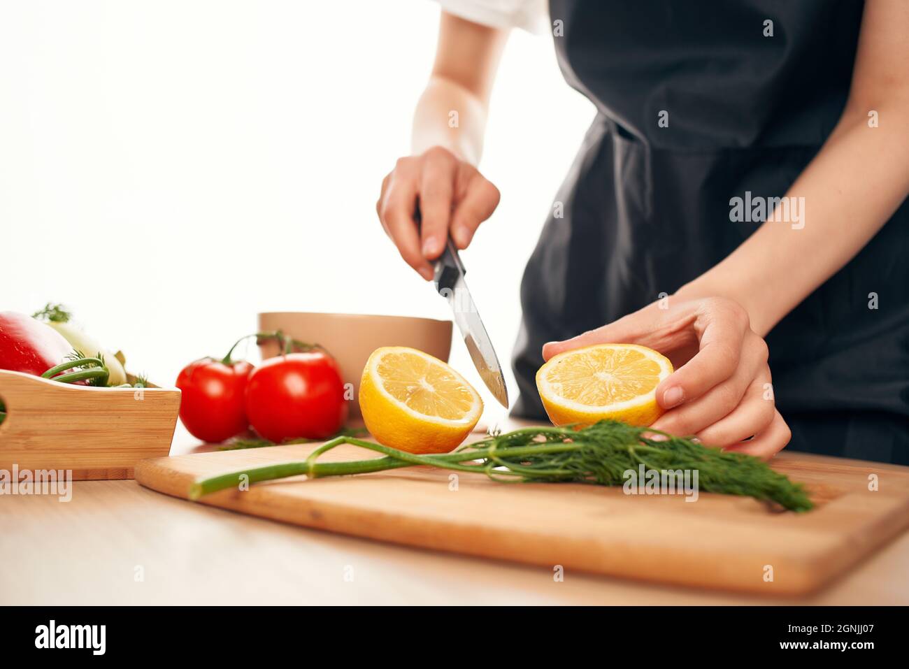 cooking salad adding ingredients healthy food kitchen Stock Photo - Alamy