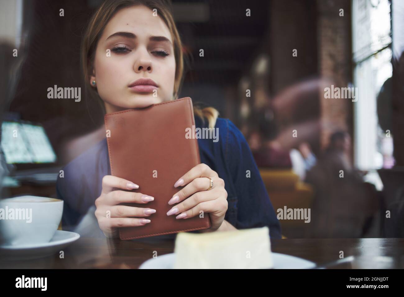 pretty woman in a cafe a cup of drink communication relaxation Stock ...