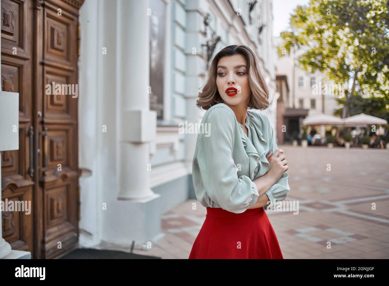 cheerful woman attractive look red lips walk in the park lifestyle ...