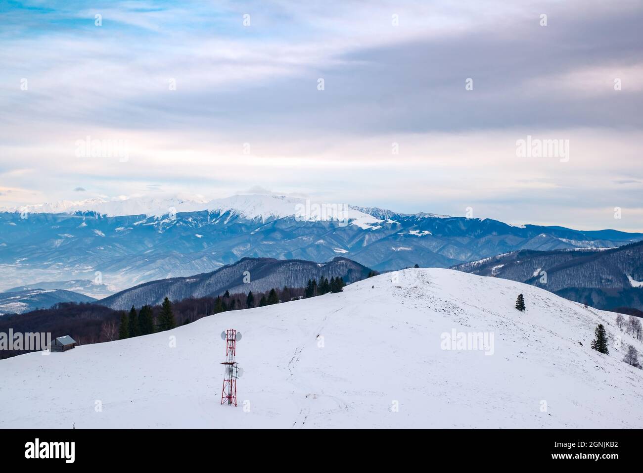 The Magura peak of Cindrel mountains in winter in Romania Stock Photo ...