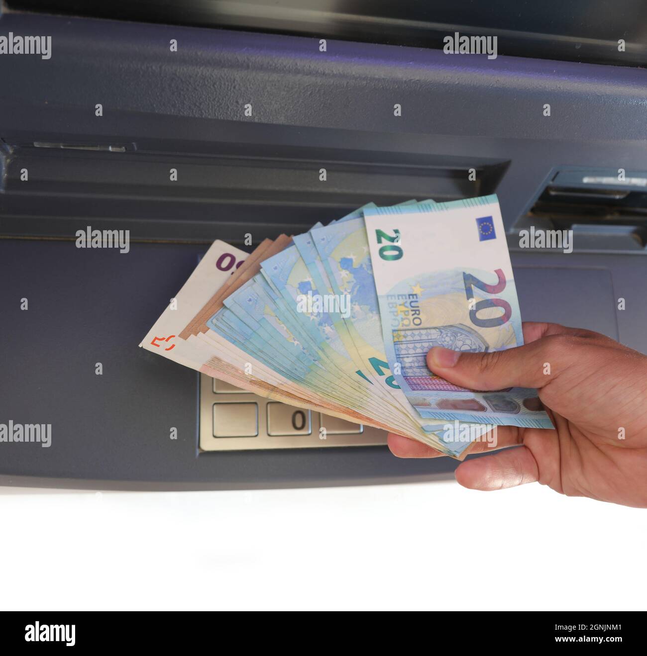 ATM and hand with euro banknotes in european city Stock Photo - Alamy
