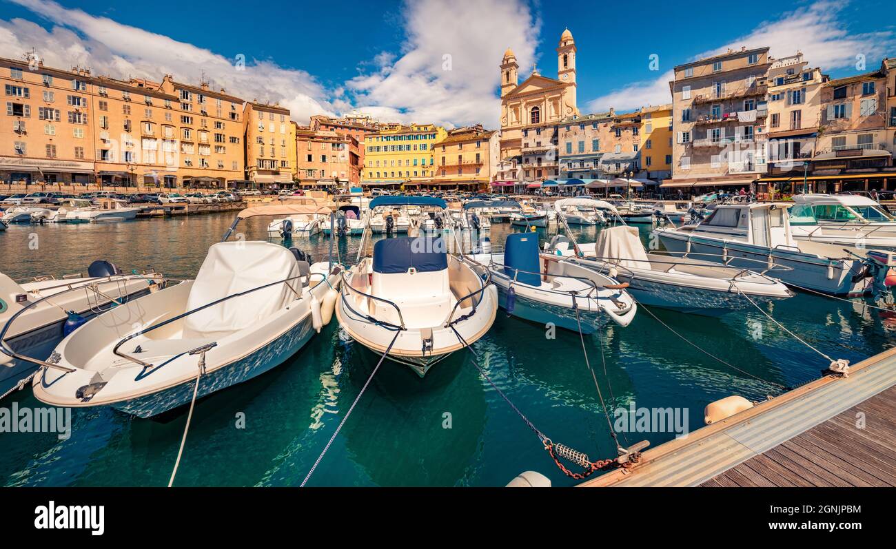 Attractive summer cityscape of Bastia port with twin-towered Church of ...