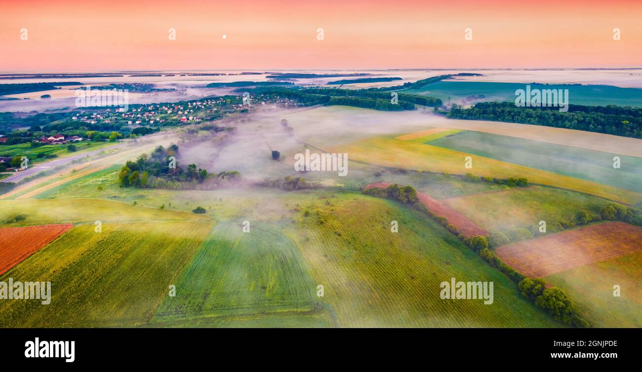 Colorful dawn on Ukrainian countryside with foggy fields. Amazing ...