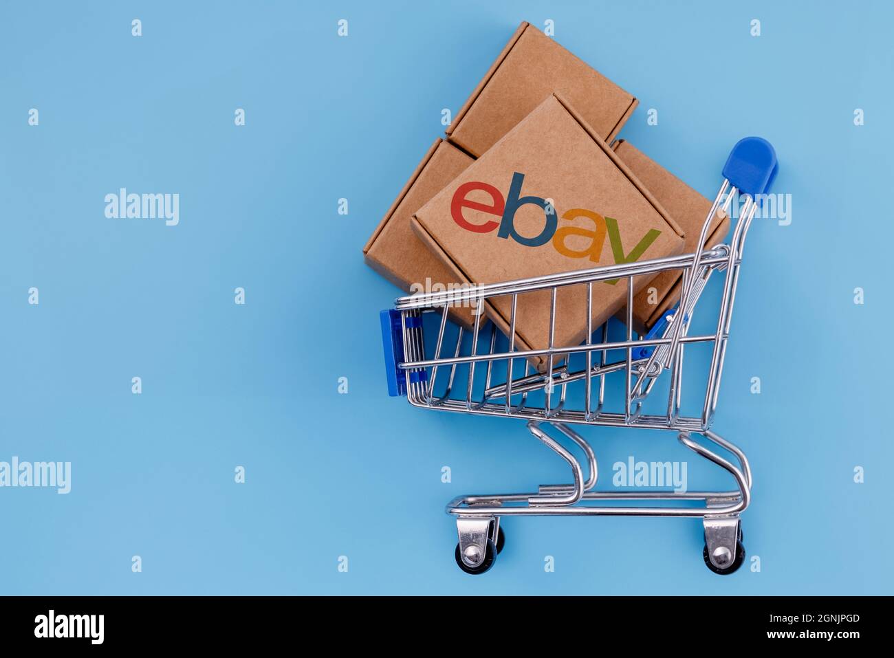 Parcel with eBay logo in the shopping cart on a blue background Stock ...