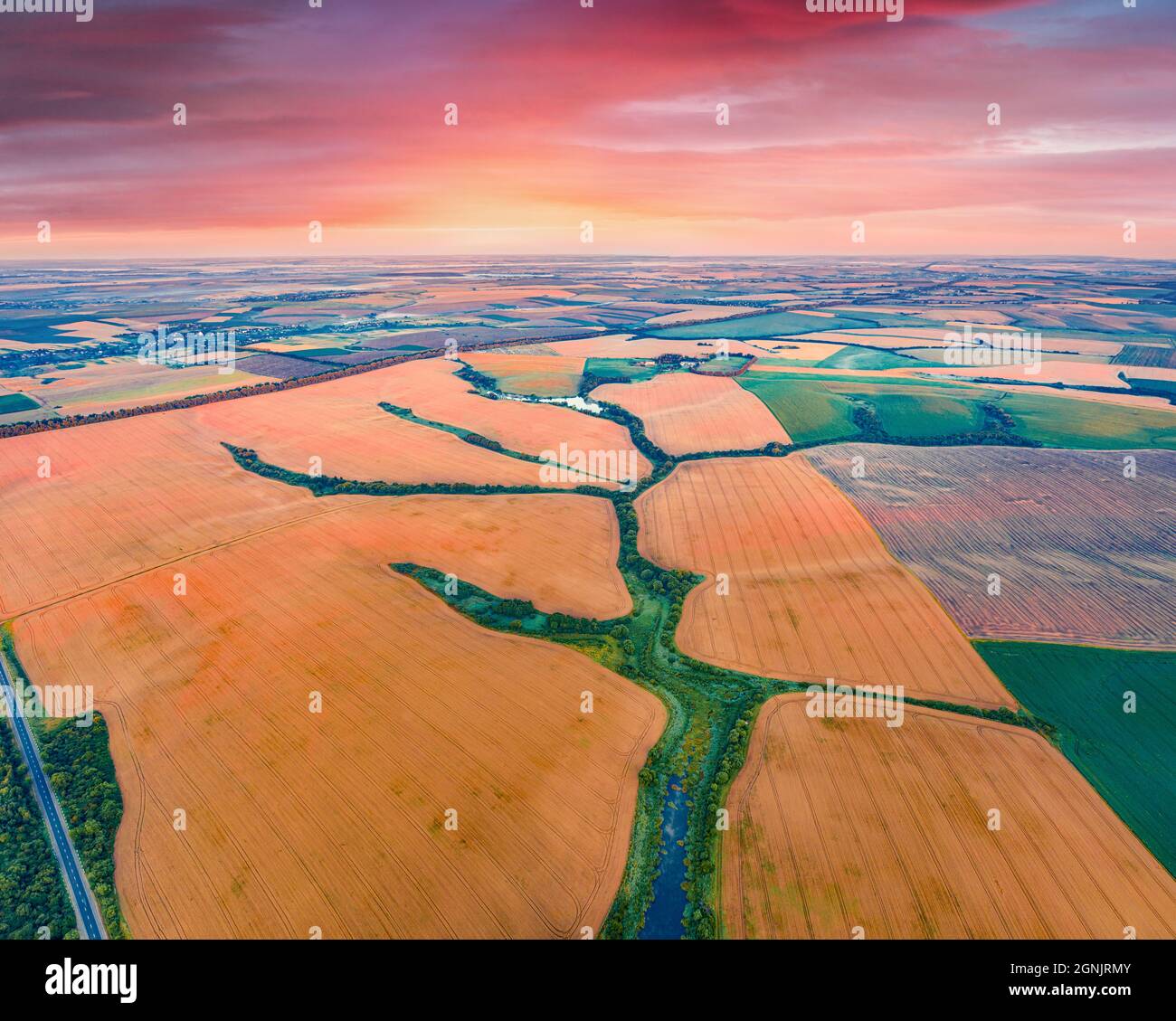 Captivating sunrise on Ukrainian countryside. River in the shape of ...