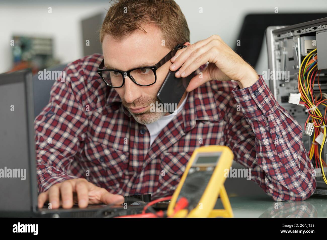 Smiling pc engineer repairing hi-res stock photography and images - Alamy