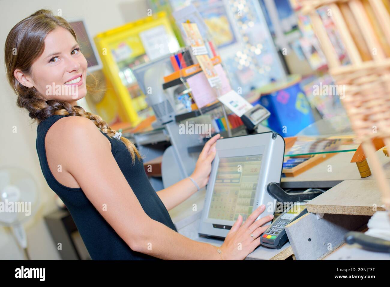 Female shop assistant till hi-res stock photography and images - Alamy