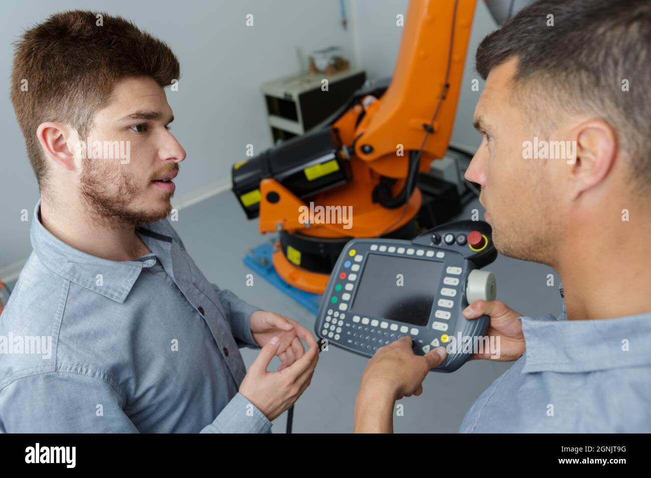 student of technology working using a robotic arm Stock Photo - Alamy