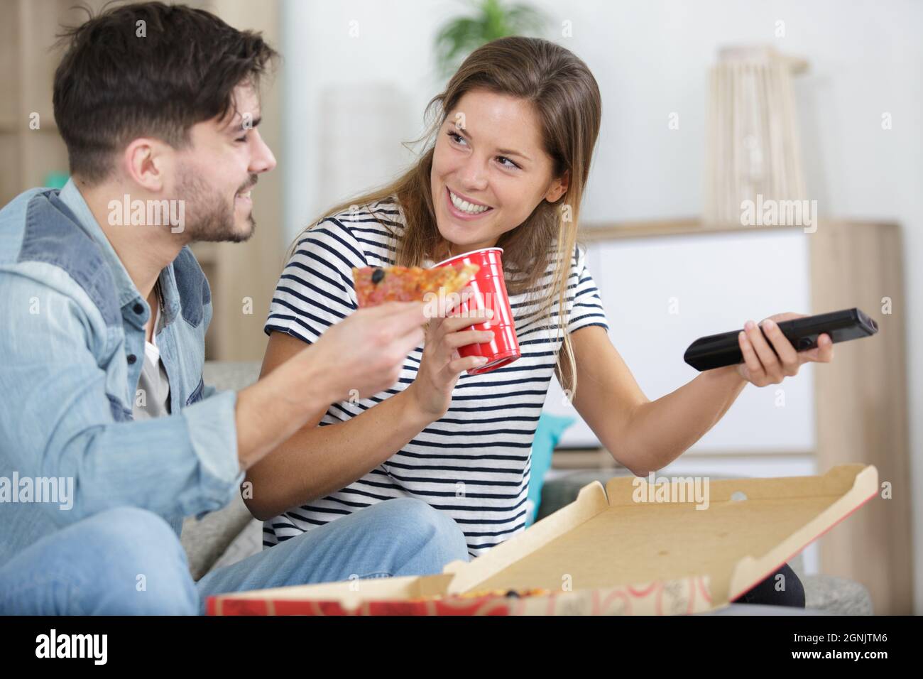 Woman eating takeaway sofa hi-res stock photography and images - Alamy