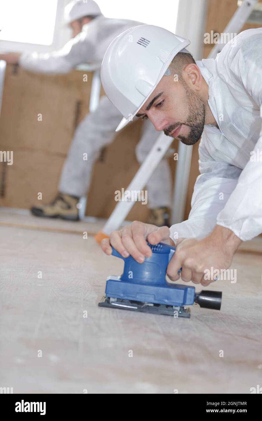 worker olishing floor with sander Stock Photo - Alamy