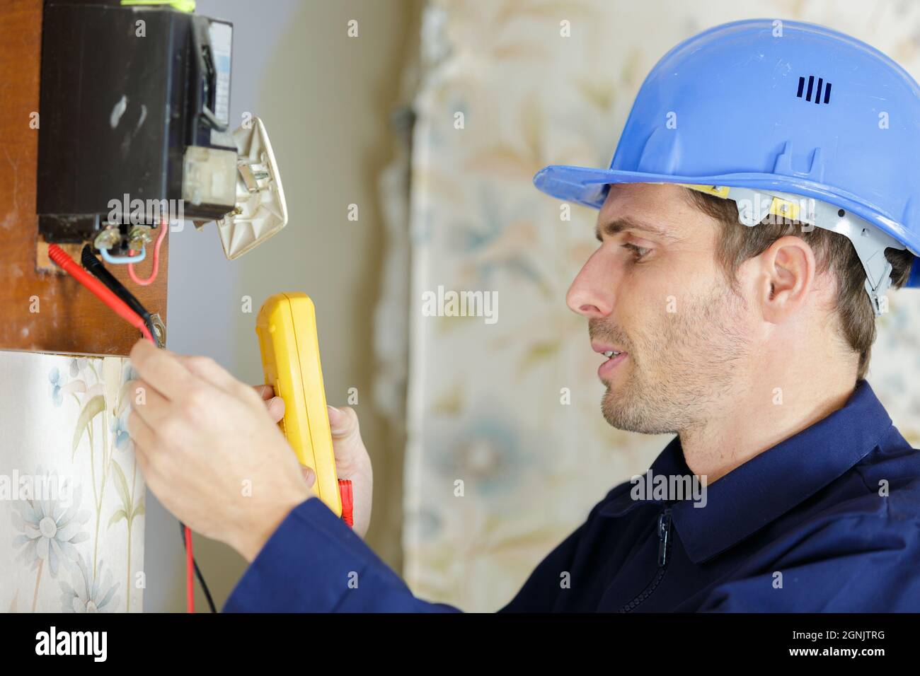 electrician measuring voltage of socket Stock Photo - Alamy