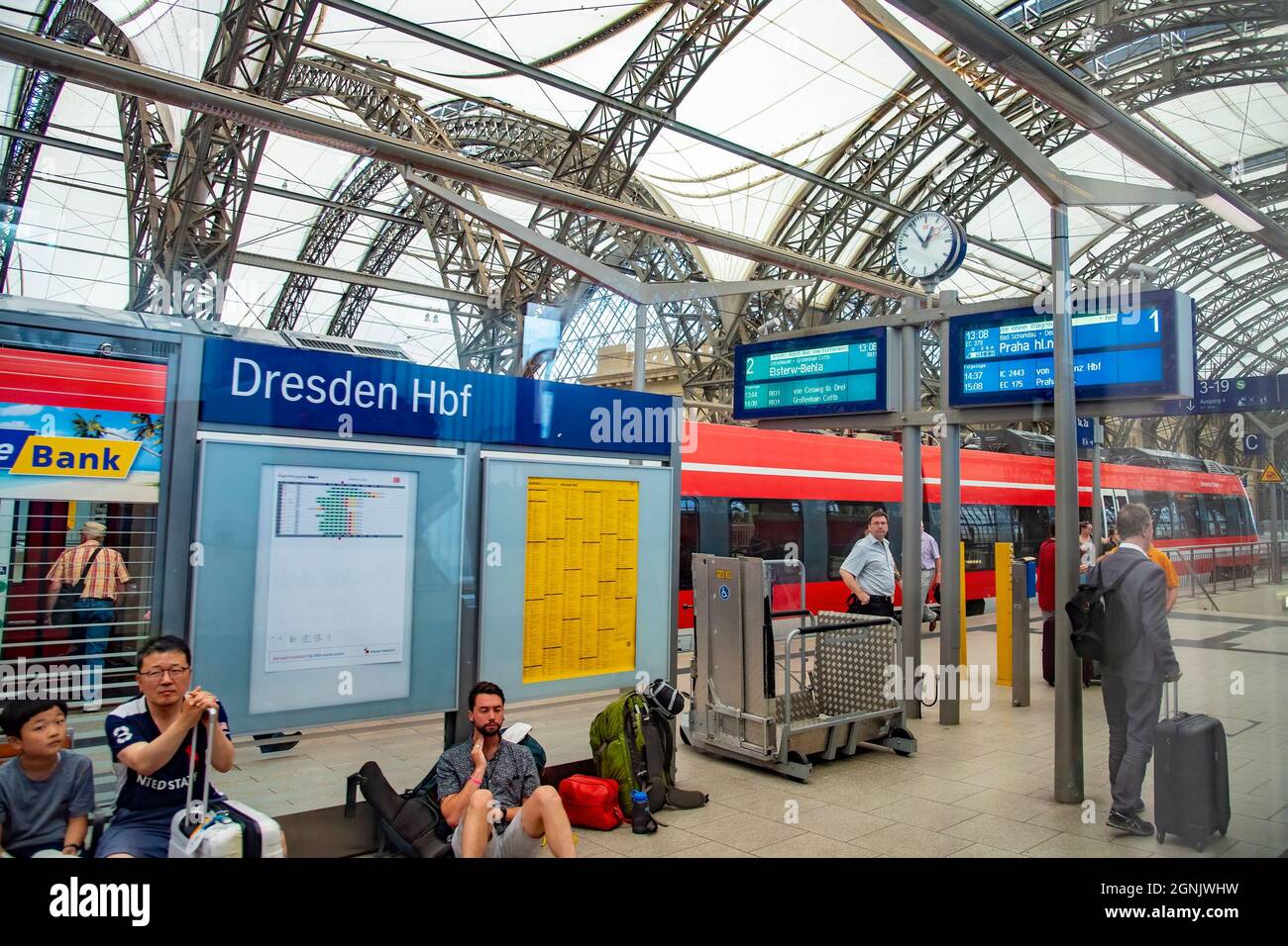 Passengers waiting for a train at the railway platform of Dresden ...