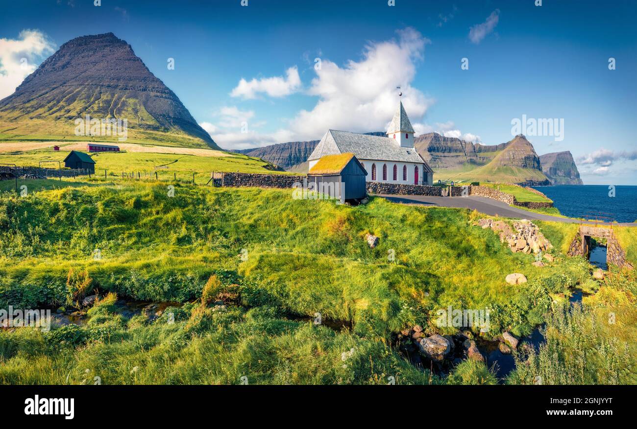 Beautiful summer scenery. Wonderful summer view of Vidareidi Kirkja ...