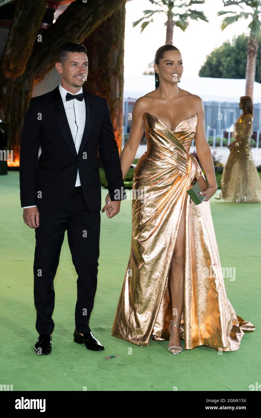 Brazilian model Adriana Lima (R) and producer Andre L III attend The ...