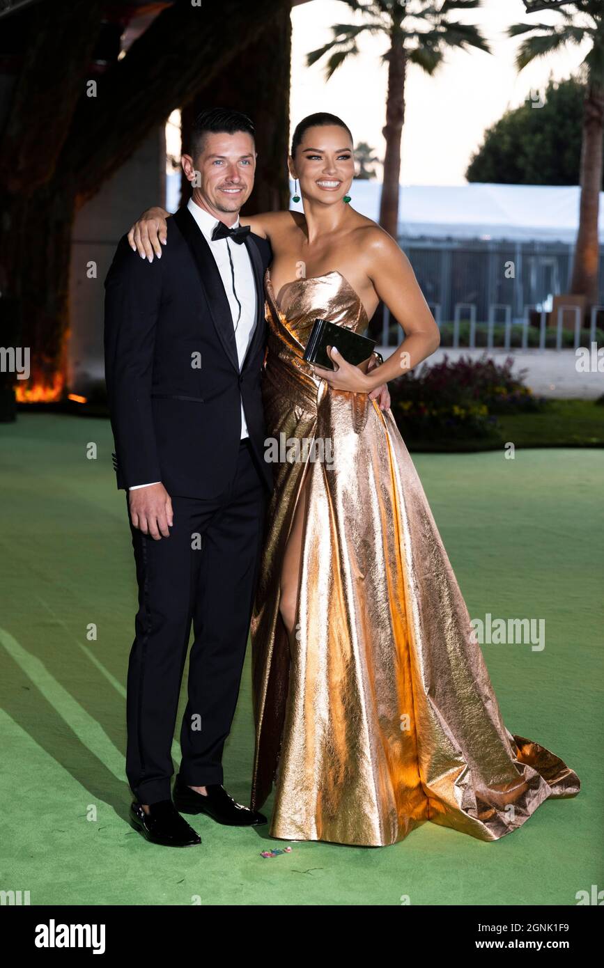 Brazilian model Adriana Lima (R) and producer Andre L III attend The ...