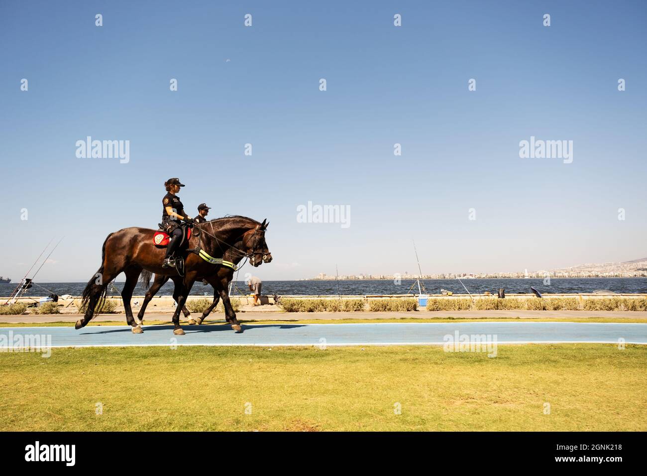 Izmir, Turkey - August 30, 2021. Police woman and man riding horses in ...