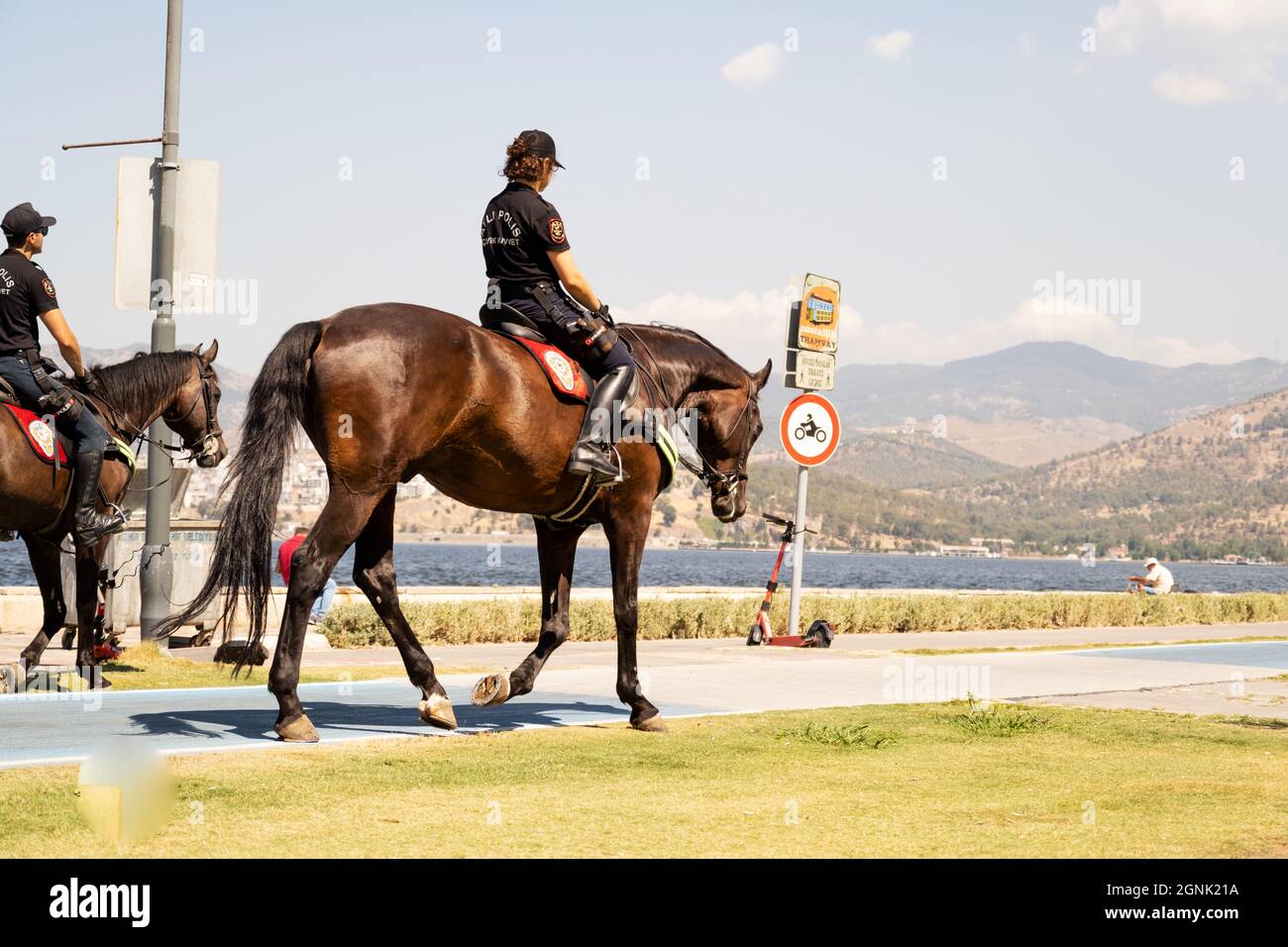 Izmir, Turkey - August 30, 2021. Police woman and man riding horses in ...
