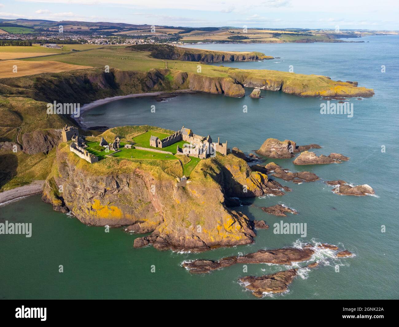 Aerial view from drone of Dunnottar Castle on cliffs above North Sea at ...