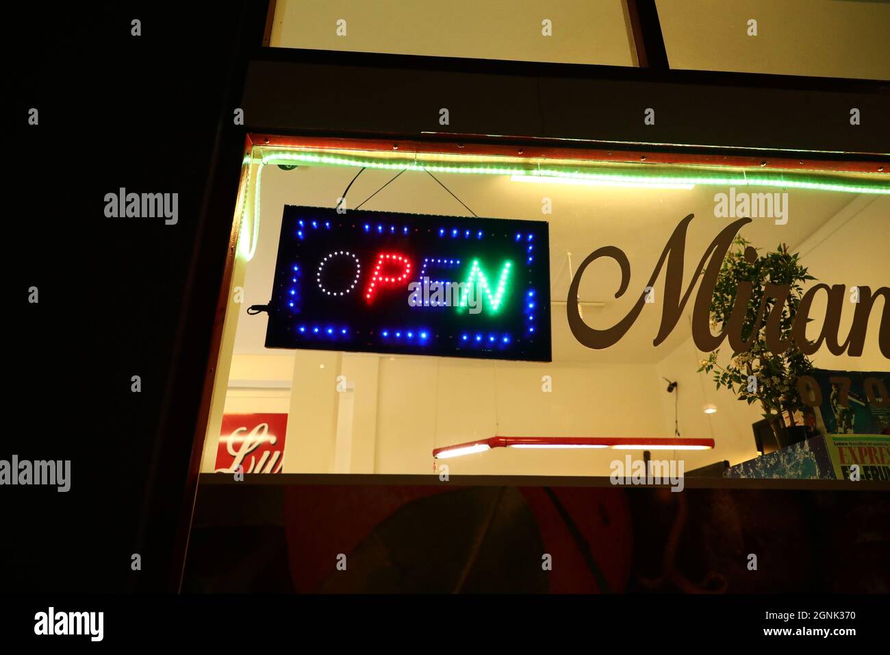 An open sign for a store Stock Photo - Alamy