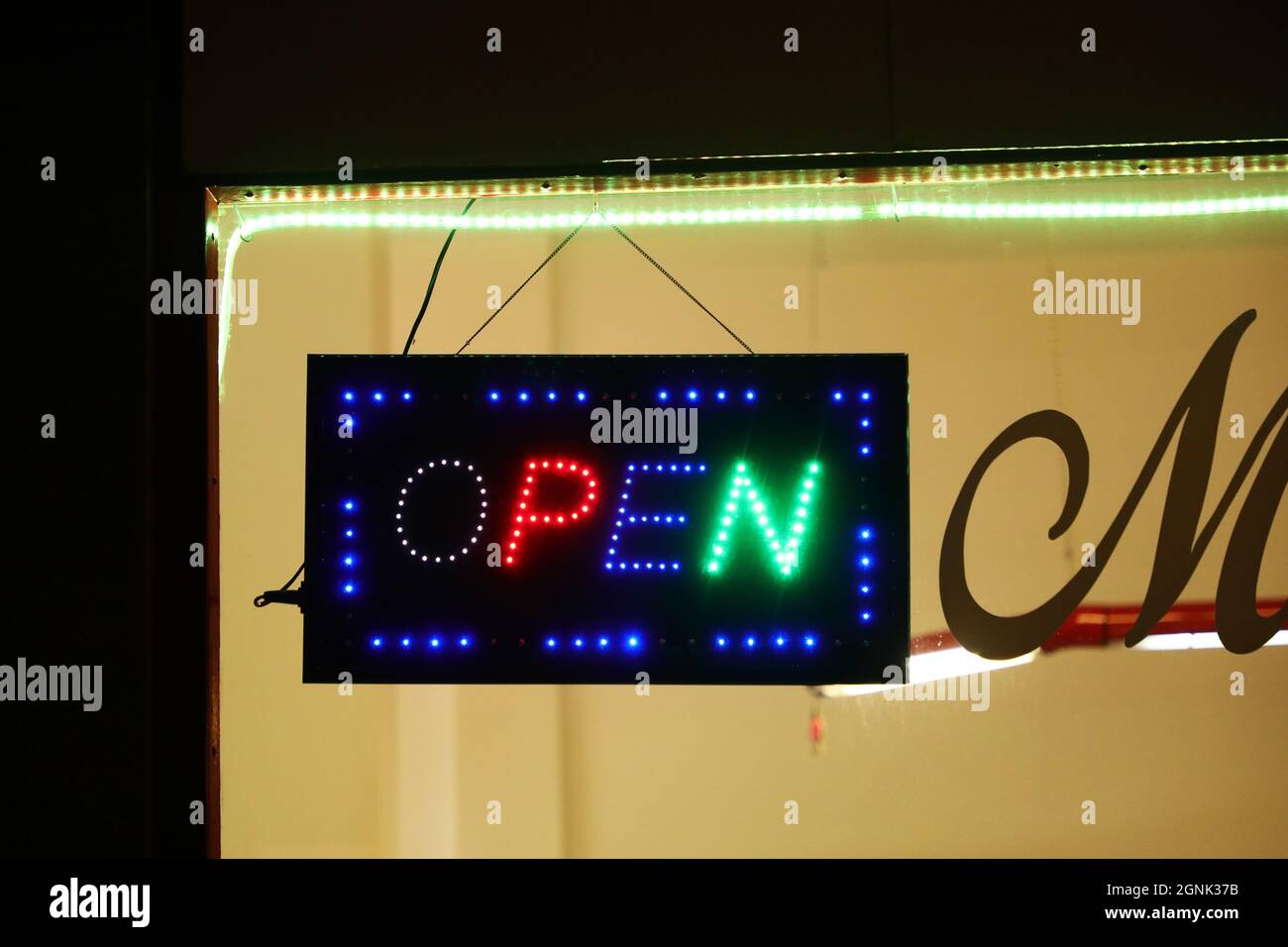 An open sign for a store Stock Photo - Alamy
