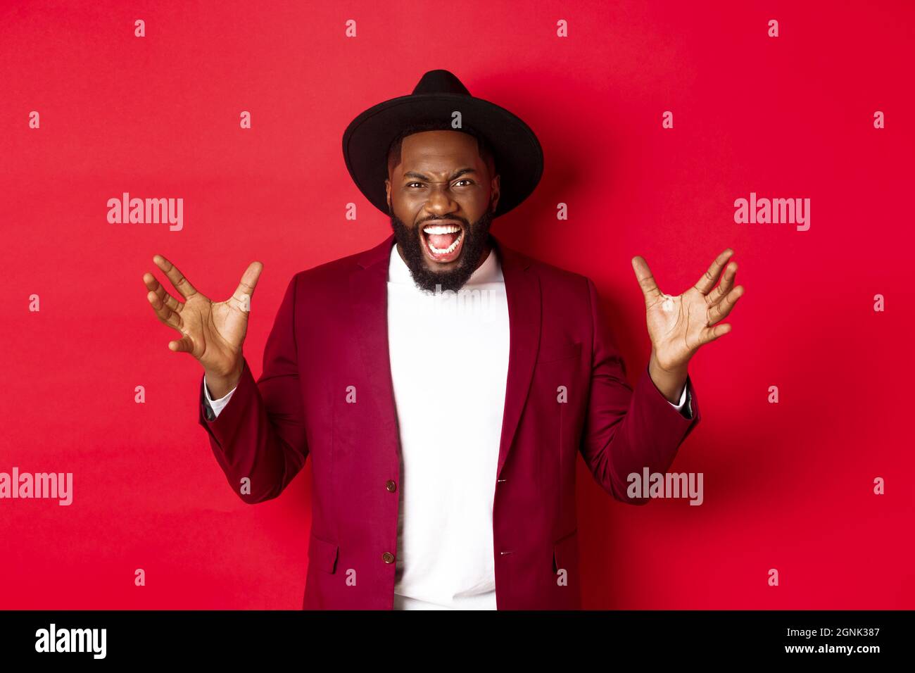 Angry Black man screaming and shaking hands with hatred, losing temper ...
