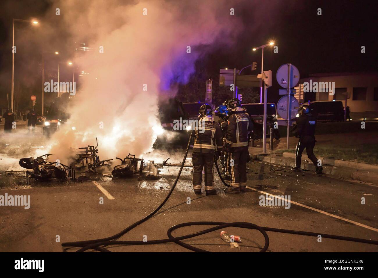 Firefighters are seen putting out a fire on the street. The traditional ...