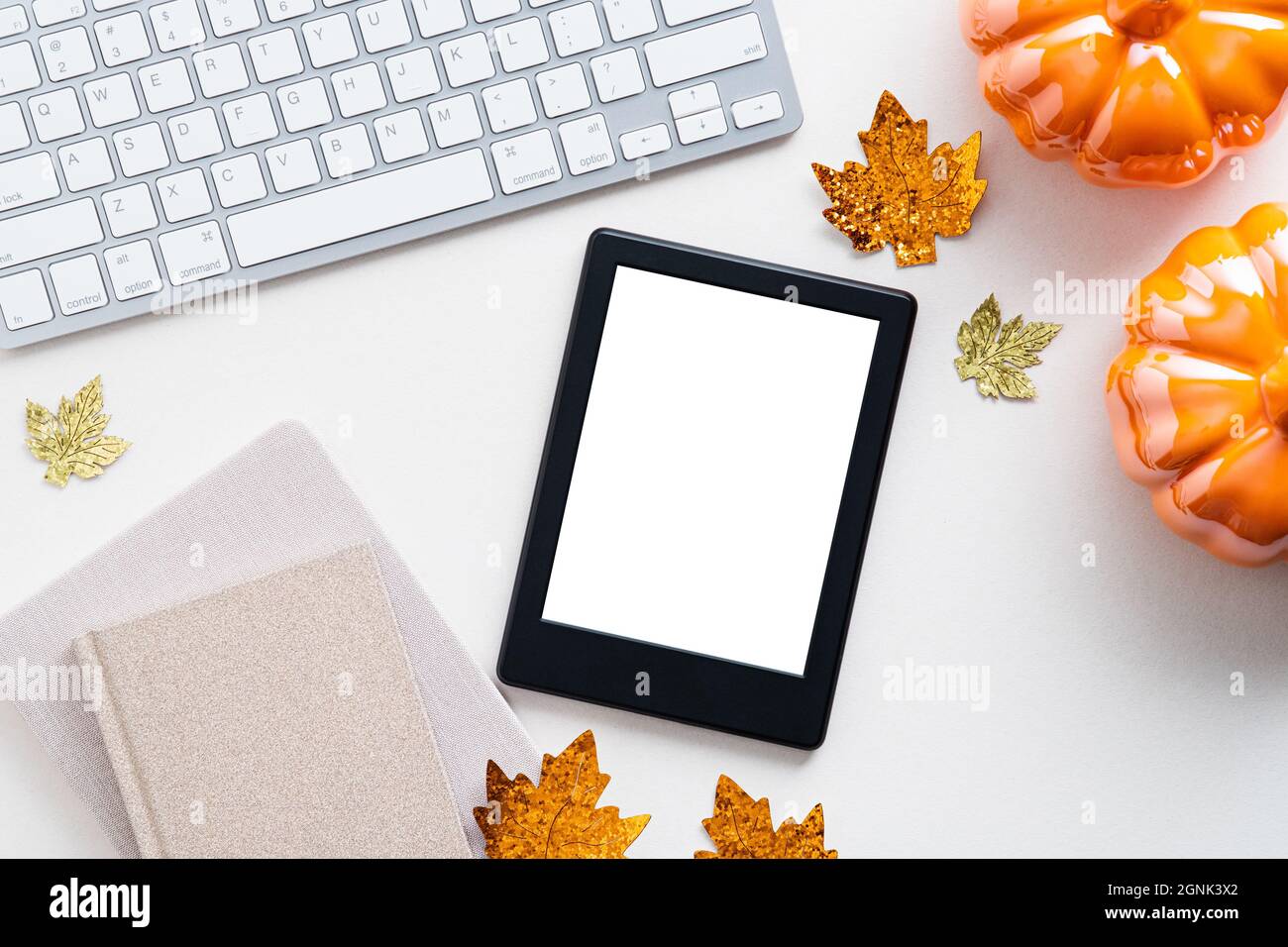 Autumn composition. Feminine desk table with pumpkins, tablet ebook ...