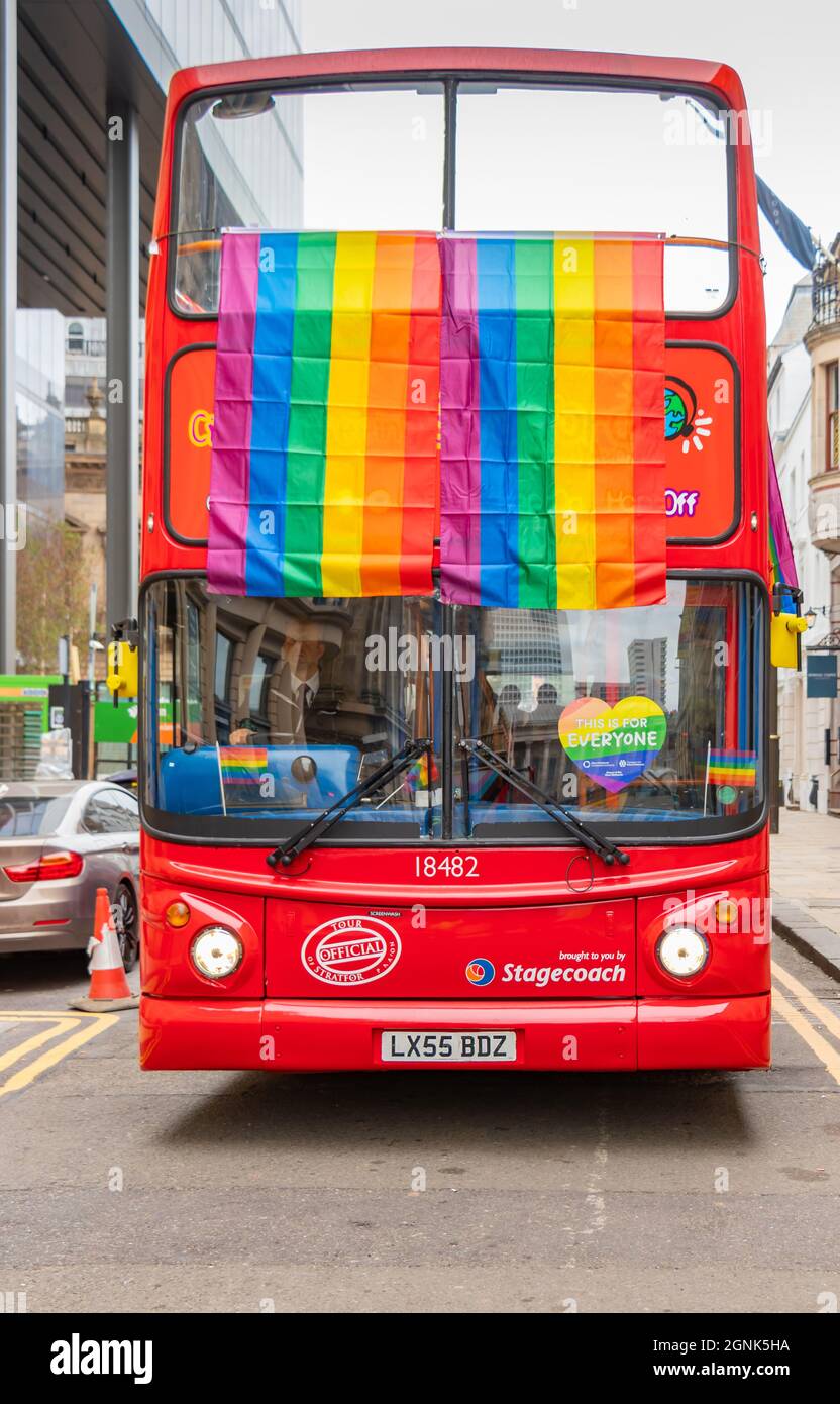 open top red double decker bus with pride rainbow flag graphics at ...