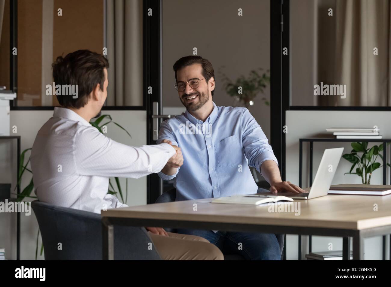 Employer, boss hiring candidate after successful job interview Stock ...