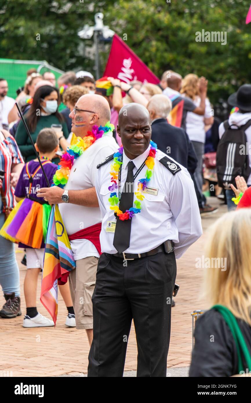 black security man wearing rainbow garland at Birmingham Pride Saturday ...
