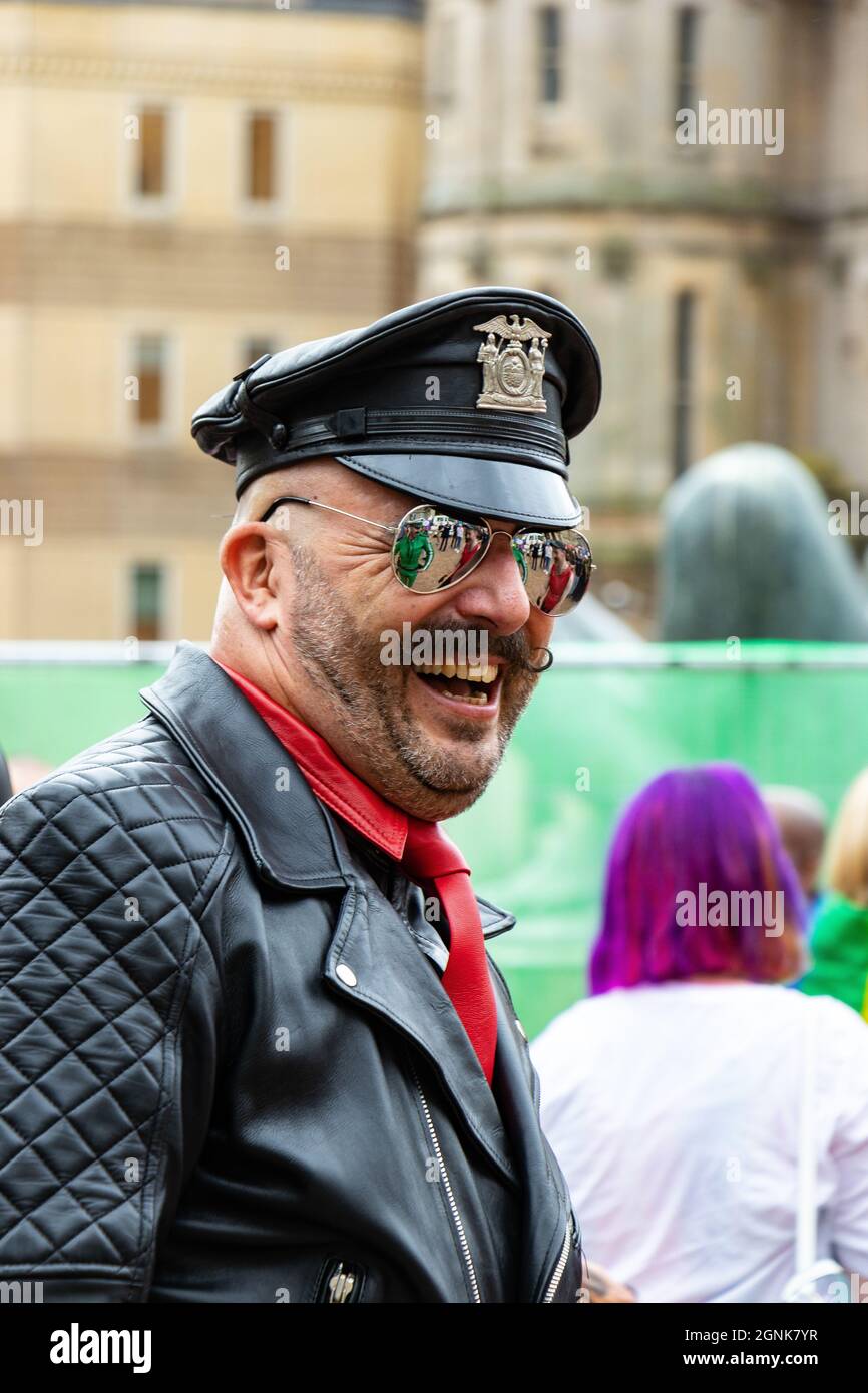 smiling macho man wearing military leather fetish gear clothing at ...