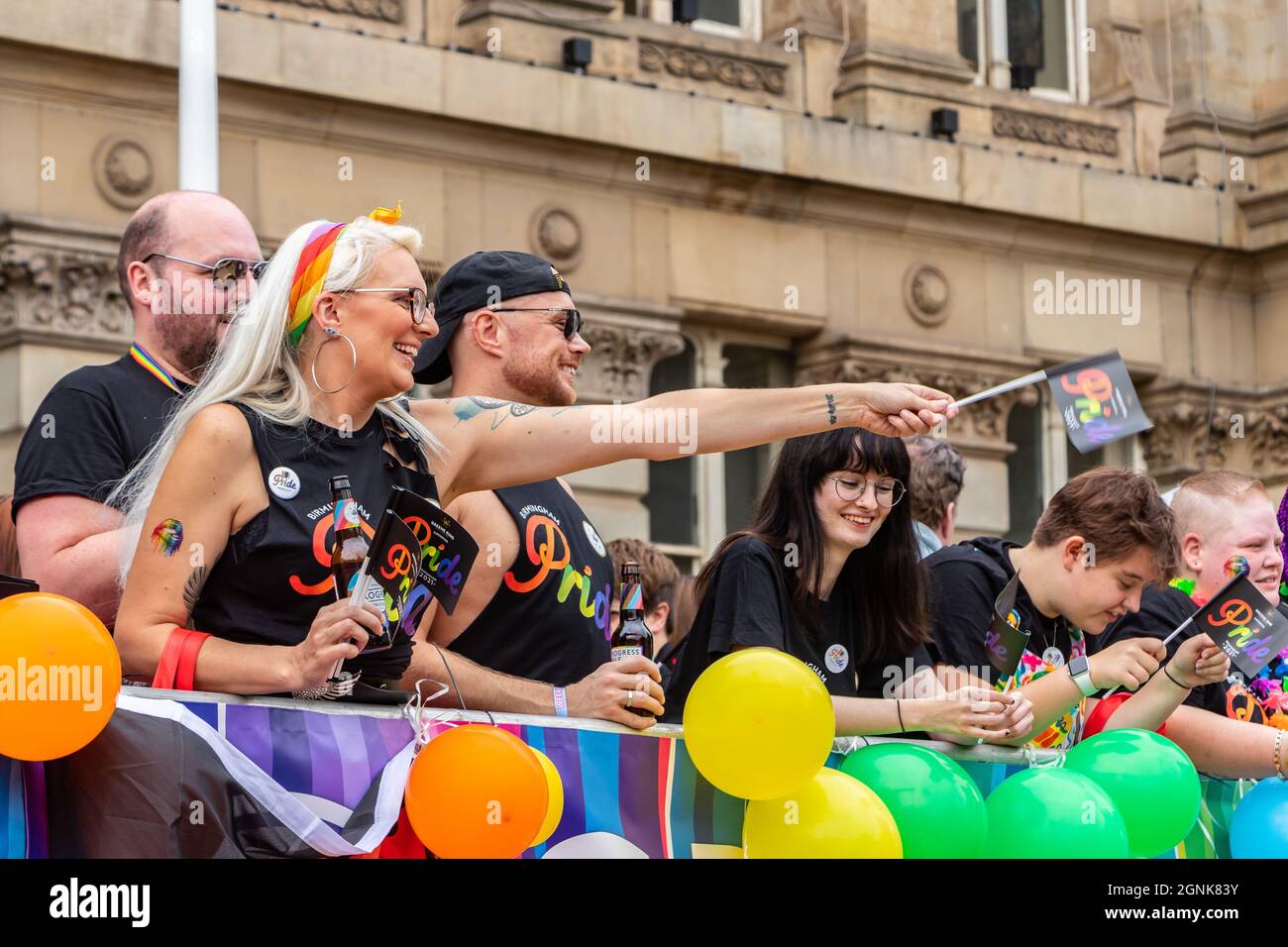 woman waving flag on parade float at Birmingham Pride Saturday 25th ...