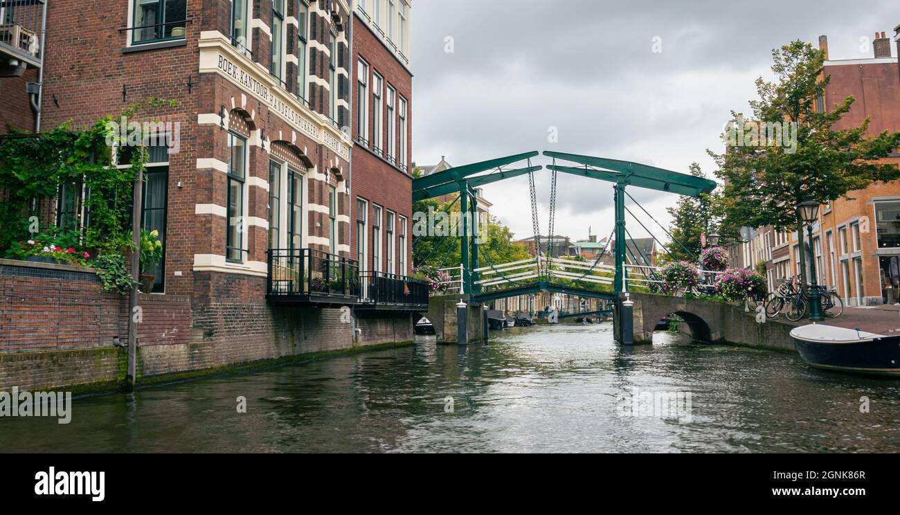 Traditional Dutch city scene with drawbridge and canal houses Stock ...