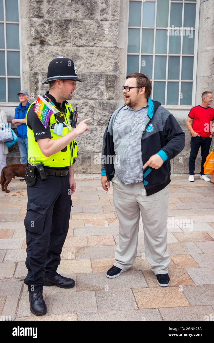 police officer with rainbow flag talks to young man at Birmingham Pride ...